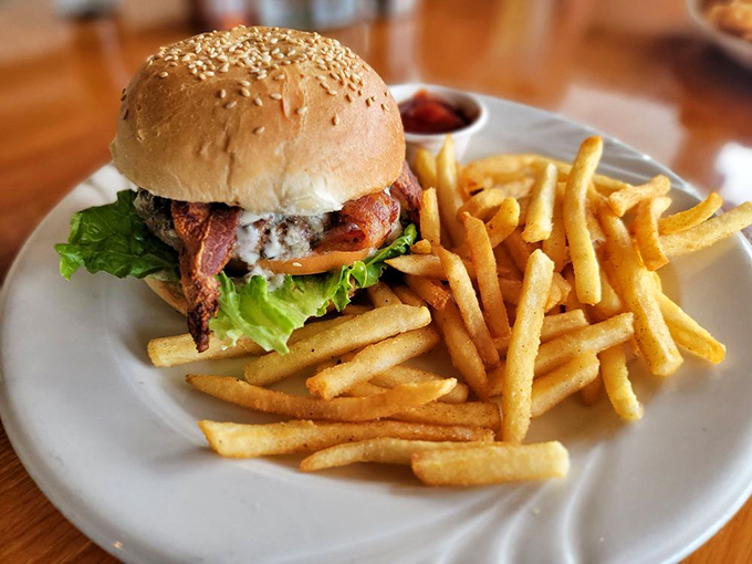 A burger that doesn't play by coastal rules—bacon, blue cheese, and beef cooked perfectly, because sometimes even seafood lovers need options.