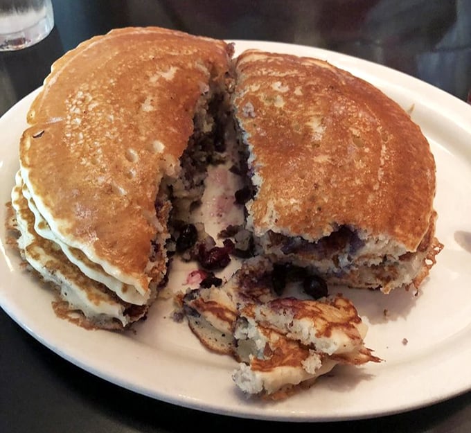 These blueberry pancakes aren't just breakfast, they're an event – split open to reveal pockets of berry goodness.