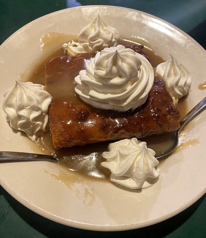 Bread pudding that would make your grandmother jealous. Those dollops of whipped cream? Little clouds of heaven surrounding comfort food perfection.