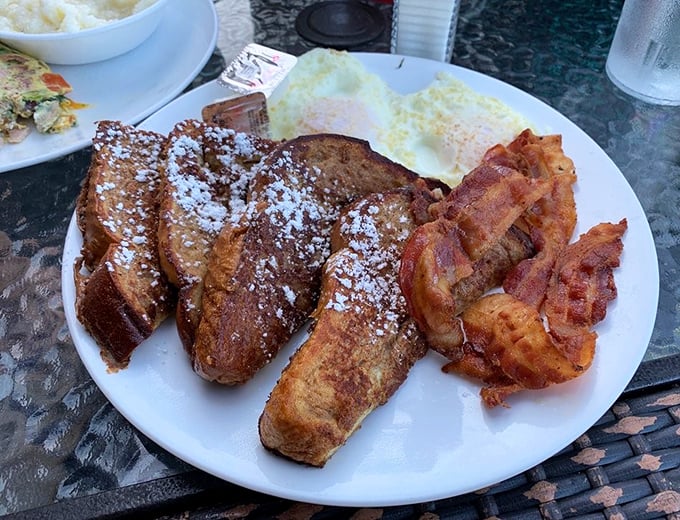 French toast that looks like it graduated summa cum laude from breakfast university, complete with crispy bacon.