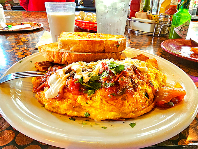 This isn't your standard diner omelet – it's a flavor fiesta wrapped in eggs, where every bite tells a story of cultural fusion.