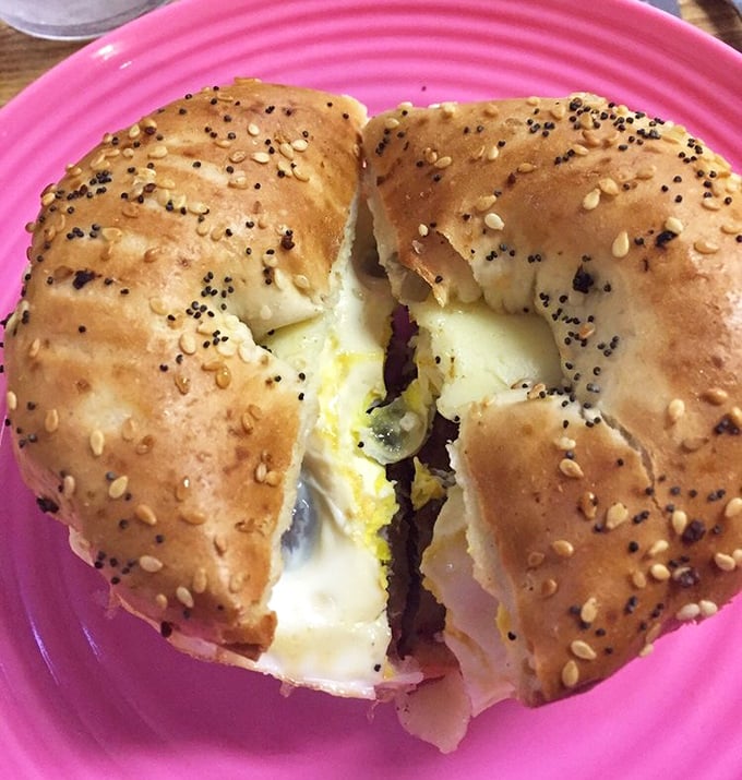 This isn't just a breakfast sandwich—it's morning architecture. The everything bagel provides the perfect foundation for this savory masterpiece.