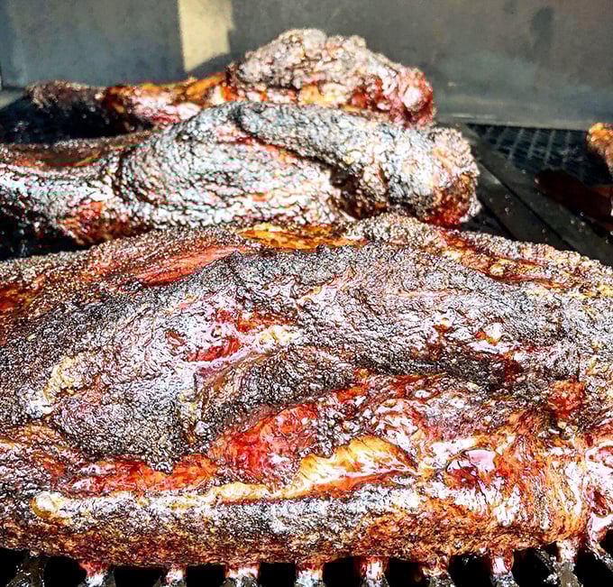 The brisket glistens with a promise kept – hours of patient smoking transformed into meat magic. This is what smoke dreams are made of.