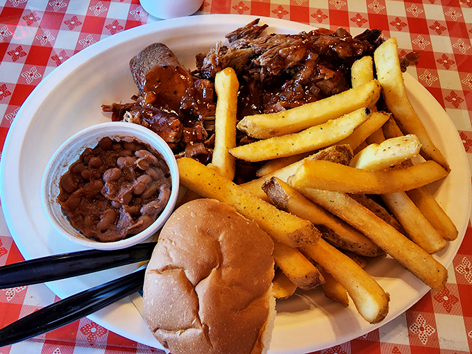 Tender, sauce-slathered brisket alongside golden fries and creamy mac and cheese – a trifecta of comfort that makes Monday feel like Saturday.