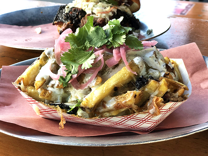 These loaded fries aren't just a side dish—they're a main event, topped with enough brisket to make a Texan nod in approval.