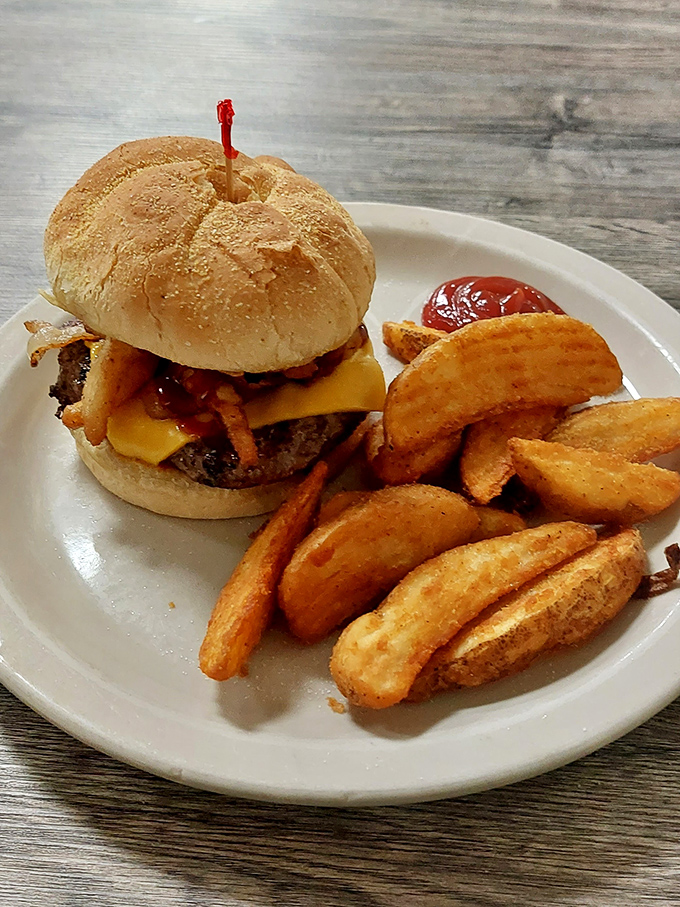 This isn't just any burger – it's the kind that requires both hands, several napkins, and absolutely no regrets afterward.