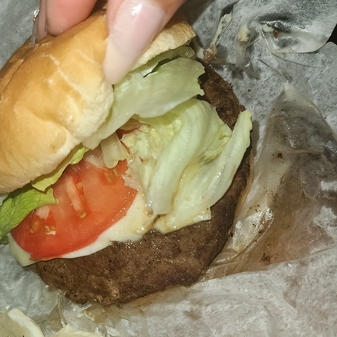 The classic American hamburger—where lettuce, tomato, and beef unite in a handheld symphony that never goes out of style.