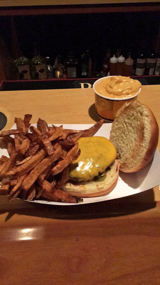 This burger doesn't need a fancy introduction—just look at those hand-cut fries standing at attention beside their beefy commander-in-chief.