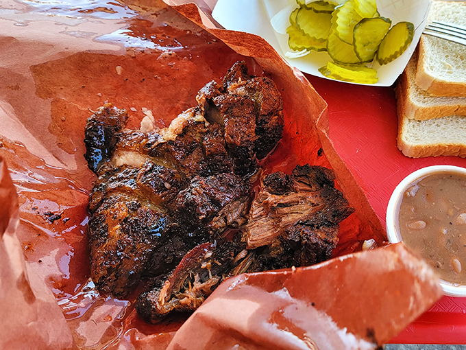 Burnt ends nestled on butcher paper—those caramelized nuggets of brisket that barbecue aficionados consider the crown jewels of smoked meat.