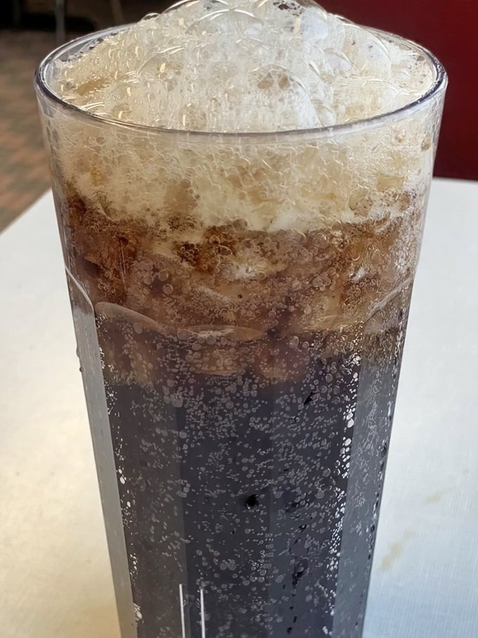This isn't just a soda—it's carbonated nostalgia in a glass. The ice melts slowly, creating that perfect sweet spot between too cold and too watery.