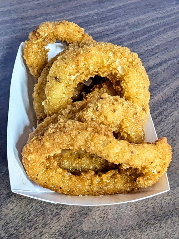 Calamari rings that look like they've earned their PhD in perfect frying. No rubber bands here – just tender squid in a crispy graduation gown.