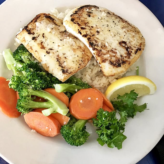 Calamari steaks grilled to perfection – proof that sometimes the best things come without tentacles attached.