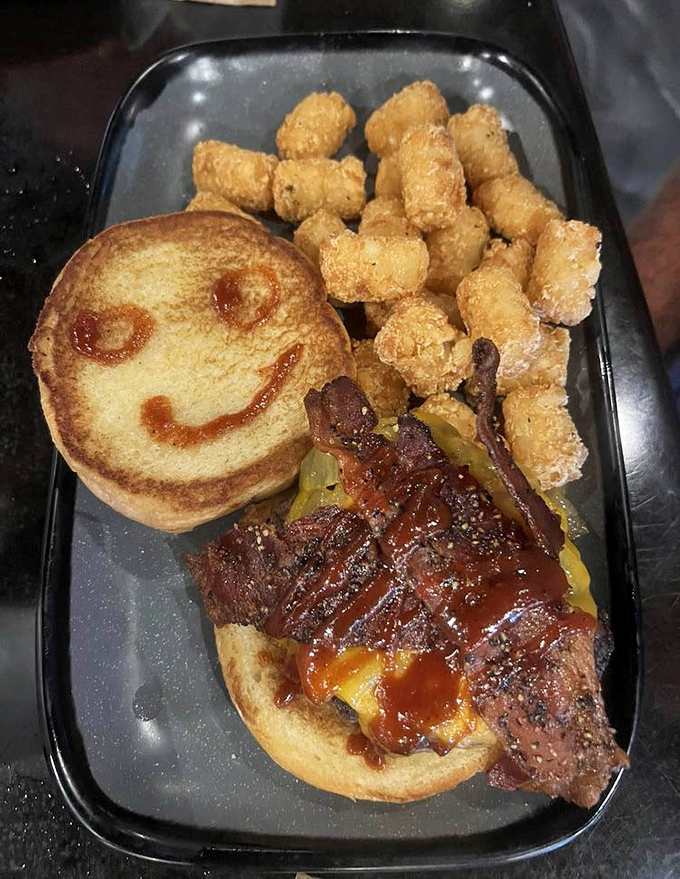 Someone drew a smiley face on this bun because they knew what was coming – pure burger bliss with candied bacon that's worth every calorie.
