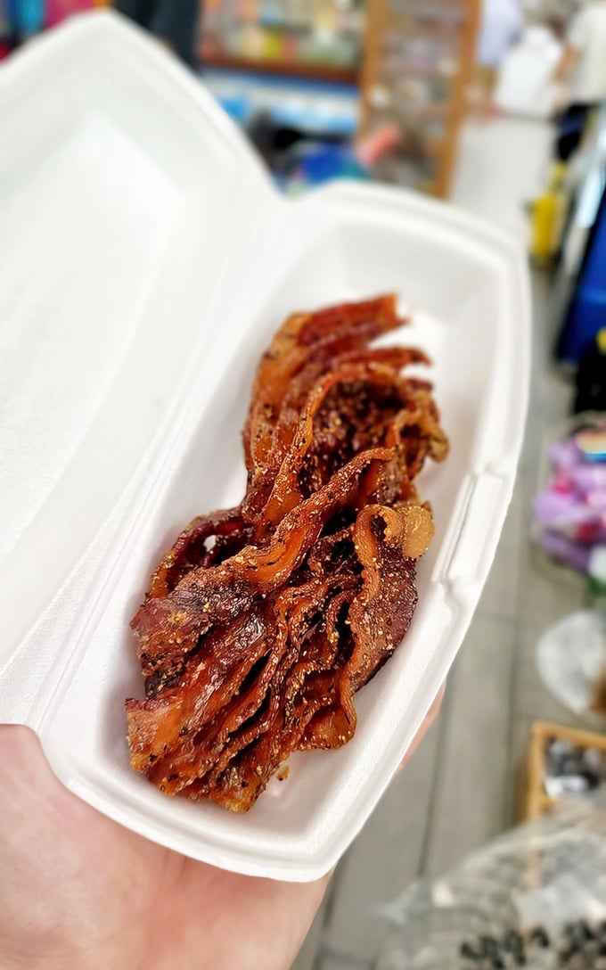 Candied bacon strips that could make a vegetarian reconsider their life choices – sweet, salty, and sinfully perfect.