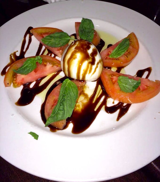 Caprese salad done right is culinary simplicity at its finest – like summer vacation arranged on a plate.