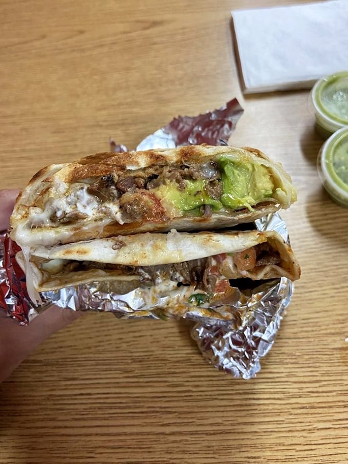 This quesadilla suiza isn't just melted cheese – it's a spiritual experience with guacamole that makes avocado toast look like amateur hour.