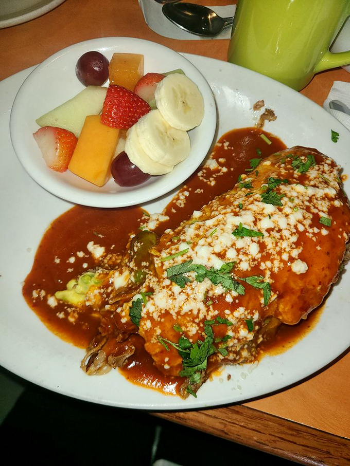 This isn't just an omelet—it's an edible love story wrapped in tortillas and smothered in a sauce that deserves its own mariachi band.