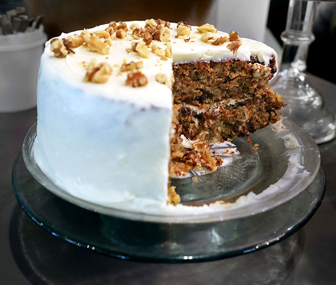 Not just dessert but an engineering marvel—layers of spiced perfection supporting a cream cheese frosting that defies gravity. Photo credit: <a href="https://www.google.com/maps/contrib/110287897304151998022/photos/@28.3640538,-82.1892192,3a,75y,90t/data=!3m7!1e2!3m5!1sAF1QipPUjIU55mAB8so92QPGKKW0Mae6ZN-FIGQvomf0!2e10!6shttps:%2F%2Flh3.googleusercontent.com%2Fp%2FAF1QipPUjIU55mAB8so92QPGKKW0Mae6ZN-FIGQvomf0%3Dw401-h260-k-no!7i1632!8i1056!4m3!8m2!3m1!1e1?entry=ttu&g_ep=EgoyMDI1MDgxMy4wIKXMDSoASAFQAw%3D%3D" target="_blank" rel="noopener noreferrer">Florida Cracker Lunch On Limoges</a>	Not just dessert but an engineering marvel—layers of spiced perfection supporting a cream cheese frosting that defies gravity.