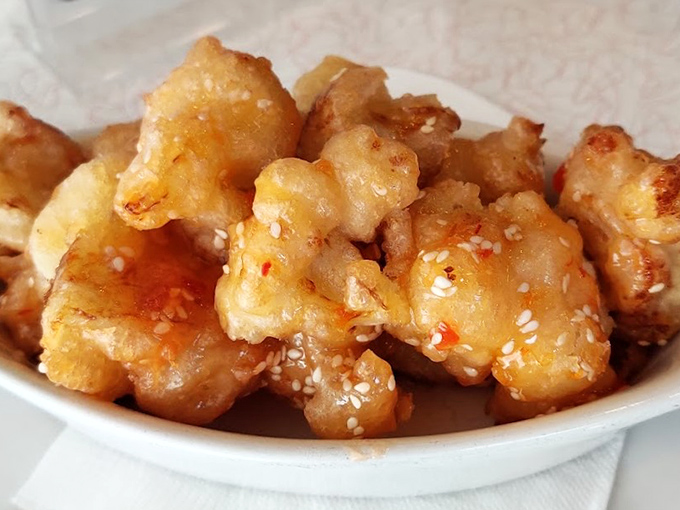 Golden cauliflower bites glistening with sweet-spicy sauce—proof that vegetables can party just as hard as their meaty counterparts.