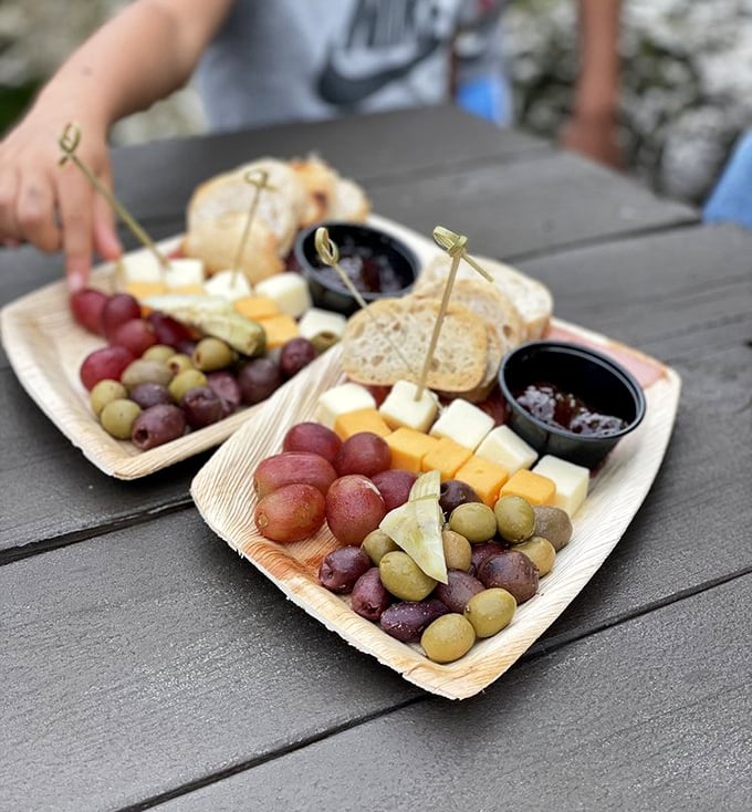 Cheese boards are civilization's greatest achievement. Forget the wheel and penicillin—this portable feast with grapes is humanity's true masterpiece.