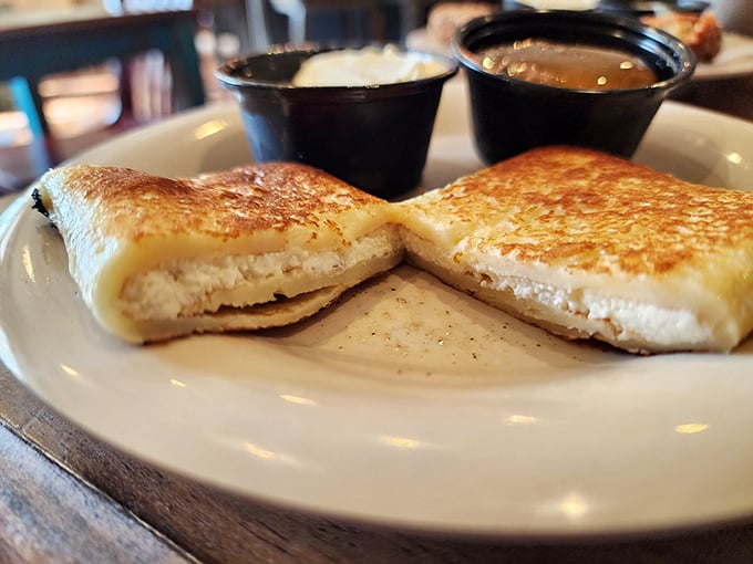 Golden-brown on the outside, cloud-soft cheese filling on the inside—these blintzes are what breakfast dreams are made of, served with perfect dipping companions.