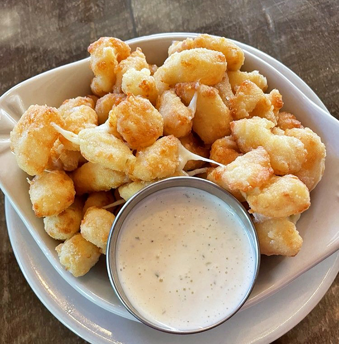 Wisconsin's unofficial state food—cheese curds—fried to golden perfection and served with a dipping sauce worth writing home about.