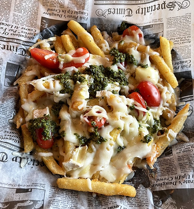 Loaded fries that require a strategy: Do you tackle the melty cheese first, or dive straight for those perfectly crisp fries underneath? Decisions, decisions.
