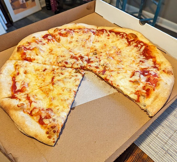 The classic cheese pizza – proof that simplicity, when executed perfectly, needs no embellishment. The holy trinity of dough, sauce, and cheese.