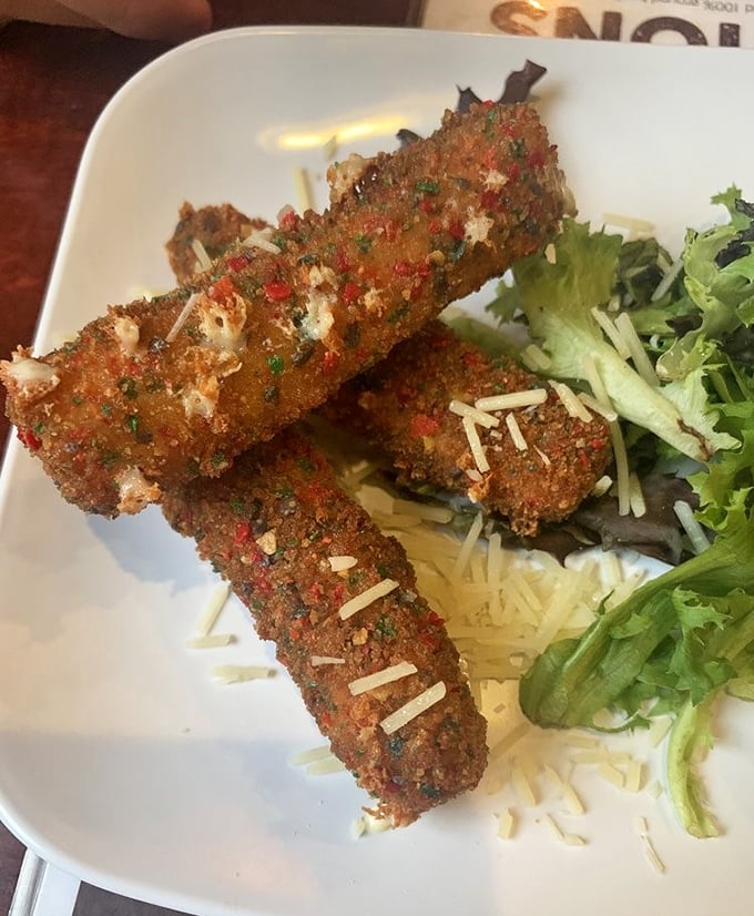 These aren't your average mozzarella sticks—they're crispy, golden-brown vessels of melty cheese joy that demand to be pulled apart dramatically.