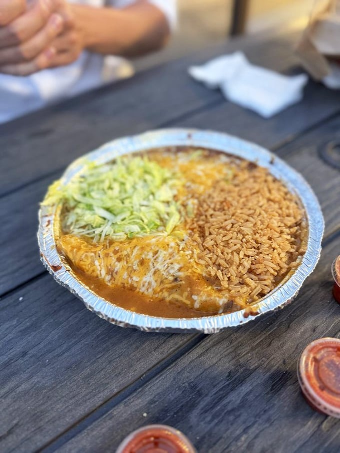 Cheese enchiladas swimming in rich sauce with perfectly cooked rice. Some dishes don't need reinvention - they just need respect.