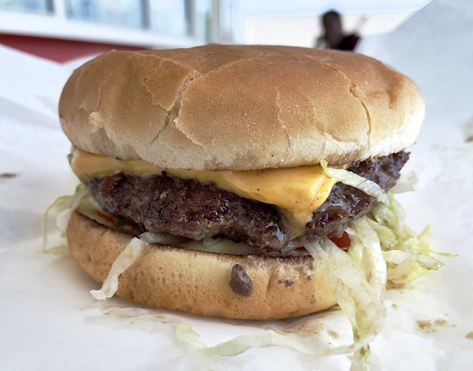 Behold: the cheeseburger in its natural habitat. No filter needed when melted cheese cascades perfectly over a hand-formed patty.