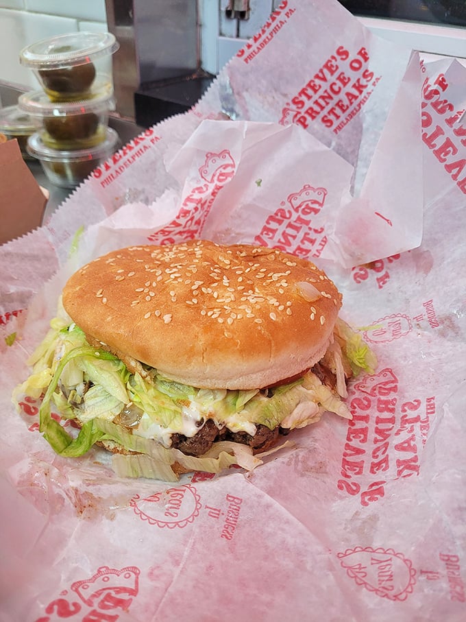 Not just a sideshow to the cheesesteak main event, this burger comes dressed for success with fresh toppings on a sesame-speckled throne.