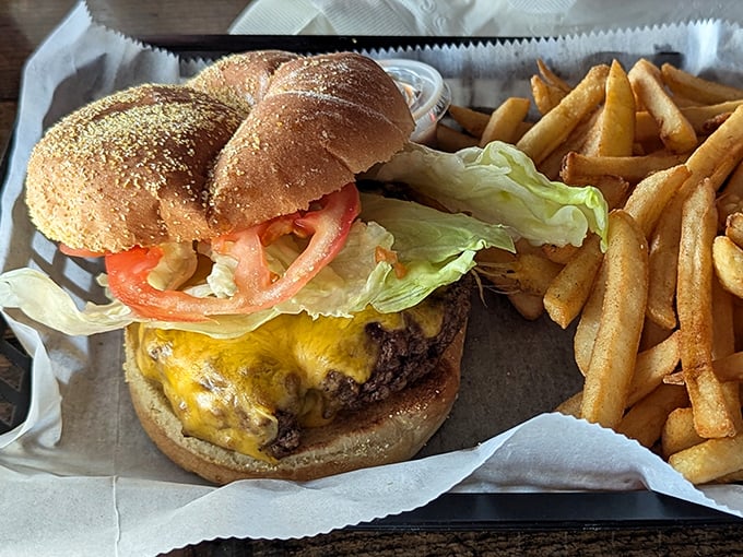Behold the cheeseburger in its natural habitat—perfectly melted cheese cascading down a hand-formed patty, no Instagram filter required.