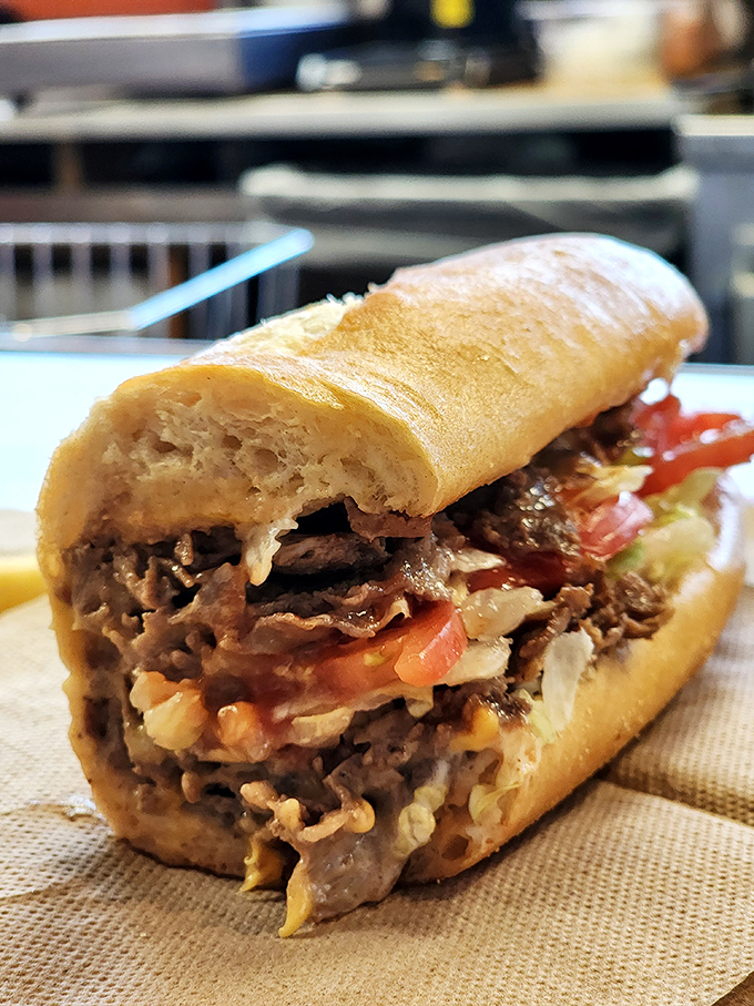 Behold the cheesesteak—a symphony of thinly sliced beef, melted cheese, and fresh veggies on a roll that's both sturdy and yielding. 