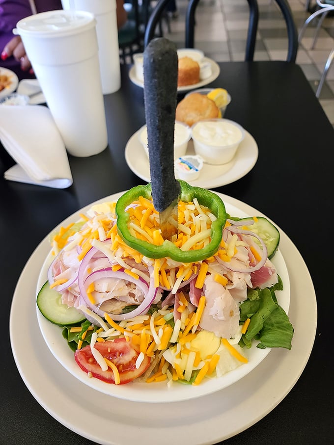 This isn't just a chef salad—it's a colorful architecture project with that green pepper ring standing tall like Florida's answer to the Eiffel Tower.