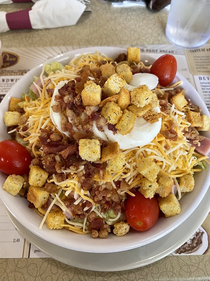 A chef's salad that doesn't skimp on the good stuff—cheese, croutons, and enough bacon bits to make even a lettuce skeptic reconsider their position.