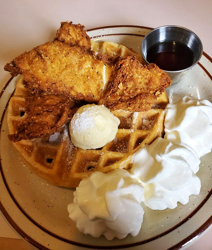 The chicken and waffles represent breakfast diplomacy at its finest—bringing together two foods that grew up in different neighborhoods but became best friends anyway.