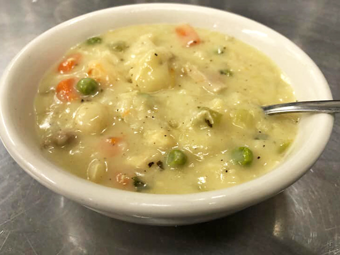 This chicken and dumpling soup isn't just a meal; it's a warm hug in a bowl, with vegetables playing supporting roles to the star attraction.
