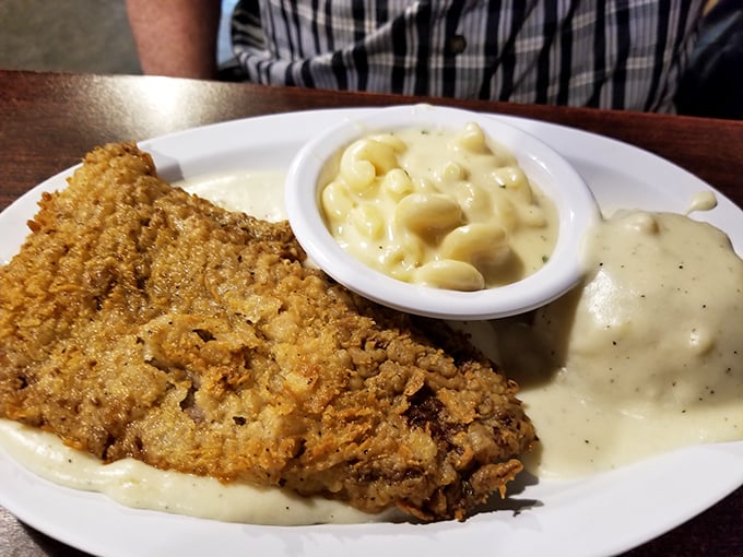 Country-fried steak that could convert vegetarians—golden, crispy coating giving way to tender meat, all swimming in creamy gravy heaven.