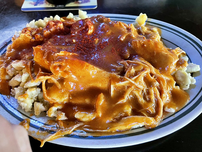 The chicken paprikash arrives like a warm hug on a plate—tender chicken nestled in rich, paprika-infused sauce over pillowy dumplings. Hungarian soul food at its finest.