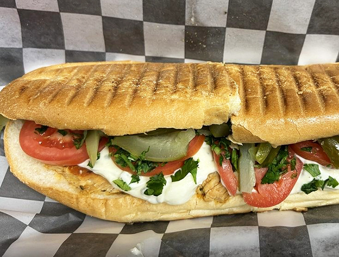 A sandwich that doesn't need to shout—grilled chicken, fresh veggies, and a perfect char mark that says "I know what I'm doing."