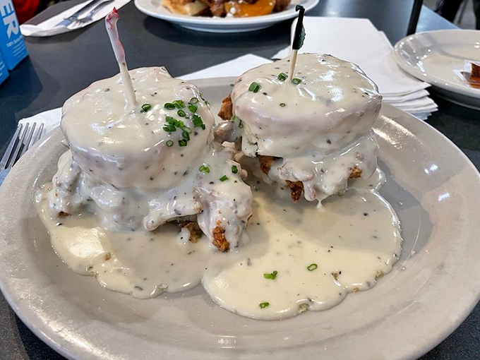 Smothered in gravy and topped with chives, these biscuits aren't just breakfast – they're an edible Southern love letter.