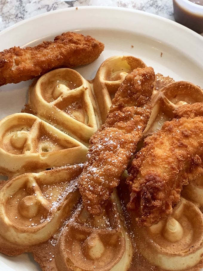 Golden waffles and crispy chicken—breakfast and lunch having a delicious identity crisis on one magnificent plate.