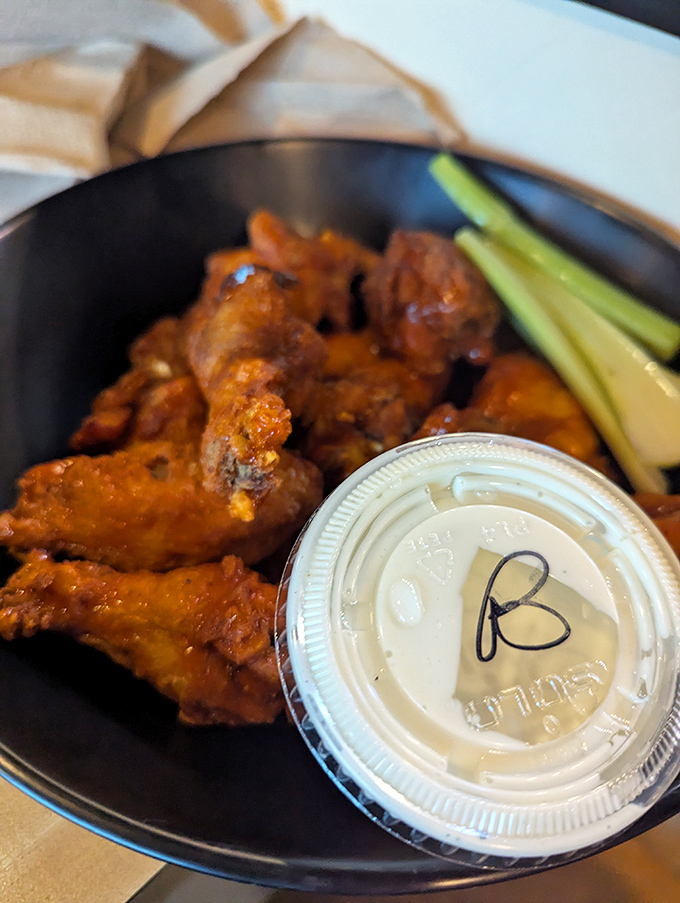 These wings aren't just cooked; they're transformed. The sauce glistens like it's auditioning for a food commercial.