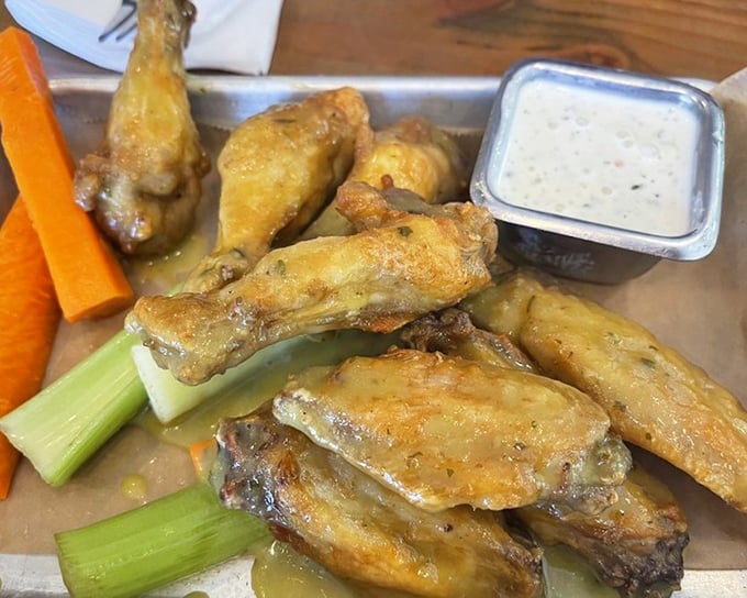 These wings aren't just crispy—they've achieved that mythical texture that makes time stop. The celery is just there as a witness.