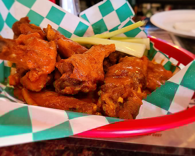 Buffalo wings that don't mess around. Crispy, saucy, and served with the obligatory celery sticks—nature's way of pretending you're eating healthy.