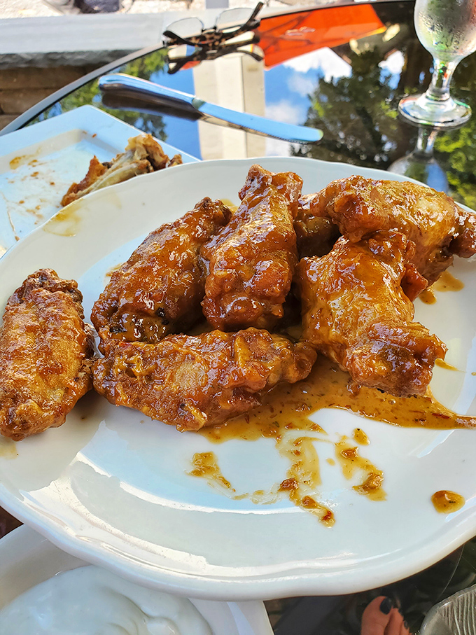 These aren't just wings; they're sticky, sweet-glazed treasures that'll have you wondering if it's socially acceptable to lick your fingers in public. (Hint: here, it is.)