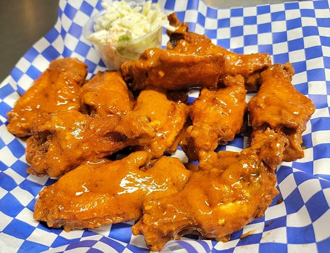 These wings aren't just tossed in sauce—they're transformed by it, like supporting actors who unexpectedly steal the entire show.