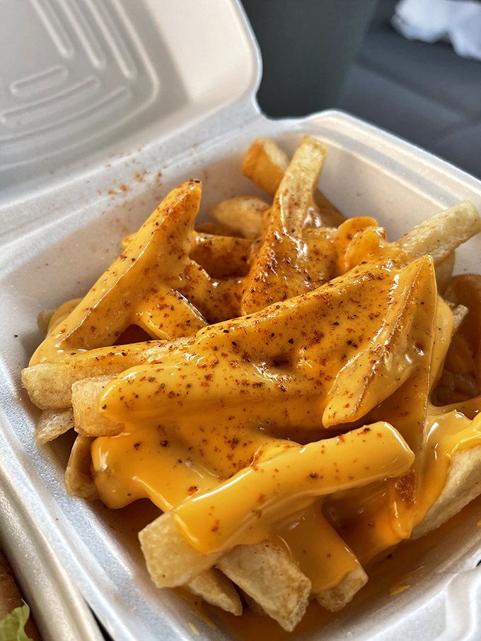 Golden fries swimming in cheese sauce—the Olympic event your stomach has been training for all year.