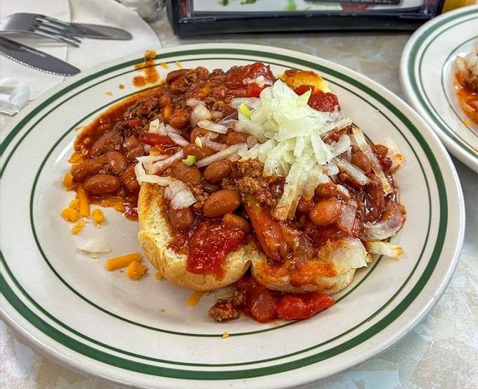 This isn't just a chili dog—it's an architectural marvel of beans, meat, cheese, and onions that requires both strategy and napkins to conquer.